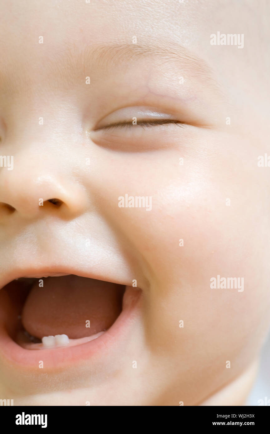 Baby laughing mouth open eyes closed hi-res stock photography and ...