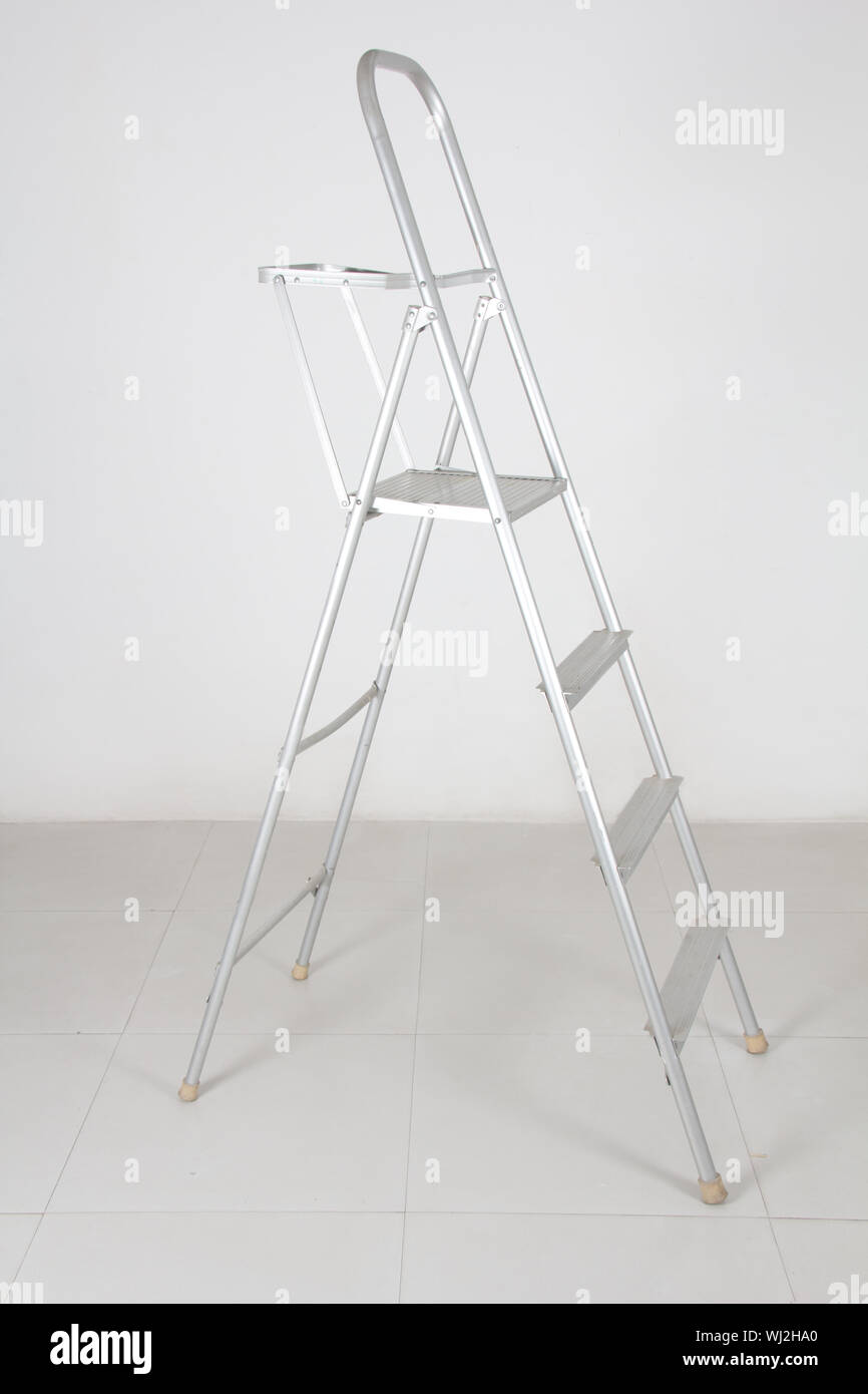 Empty foldable step ladder Stock Photo - Alamy
