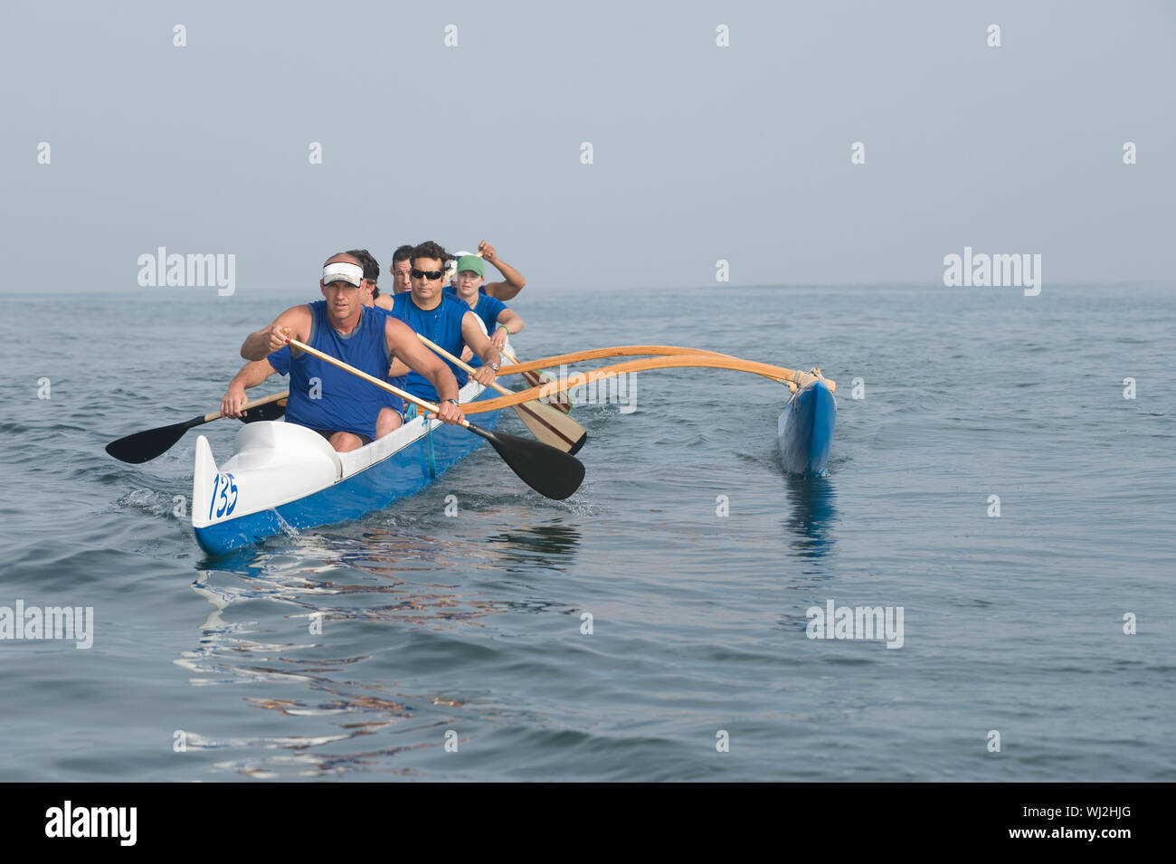 Man and woman on outrigger boat hi-res stock photography and images - Alamy