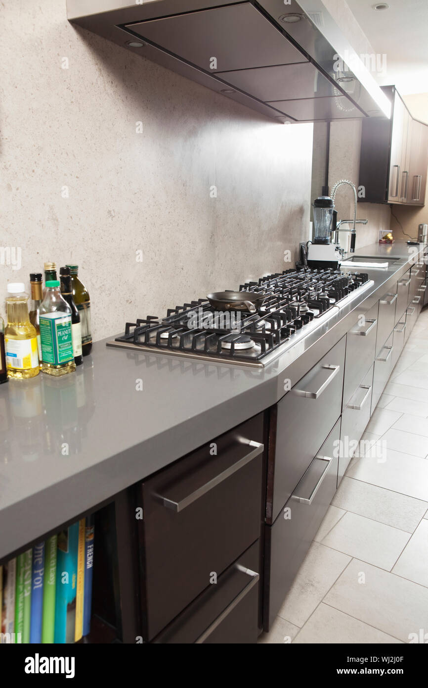 Interior of empty commercial kitchen with stove and drawers Stock Photo ...