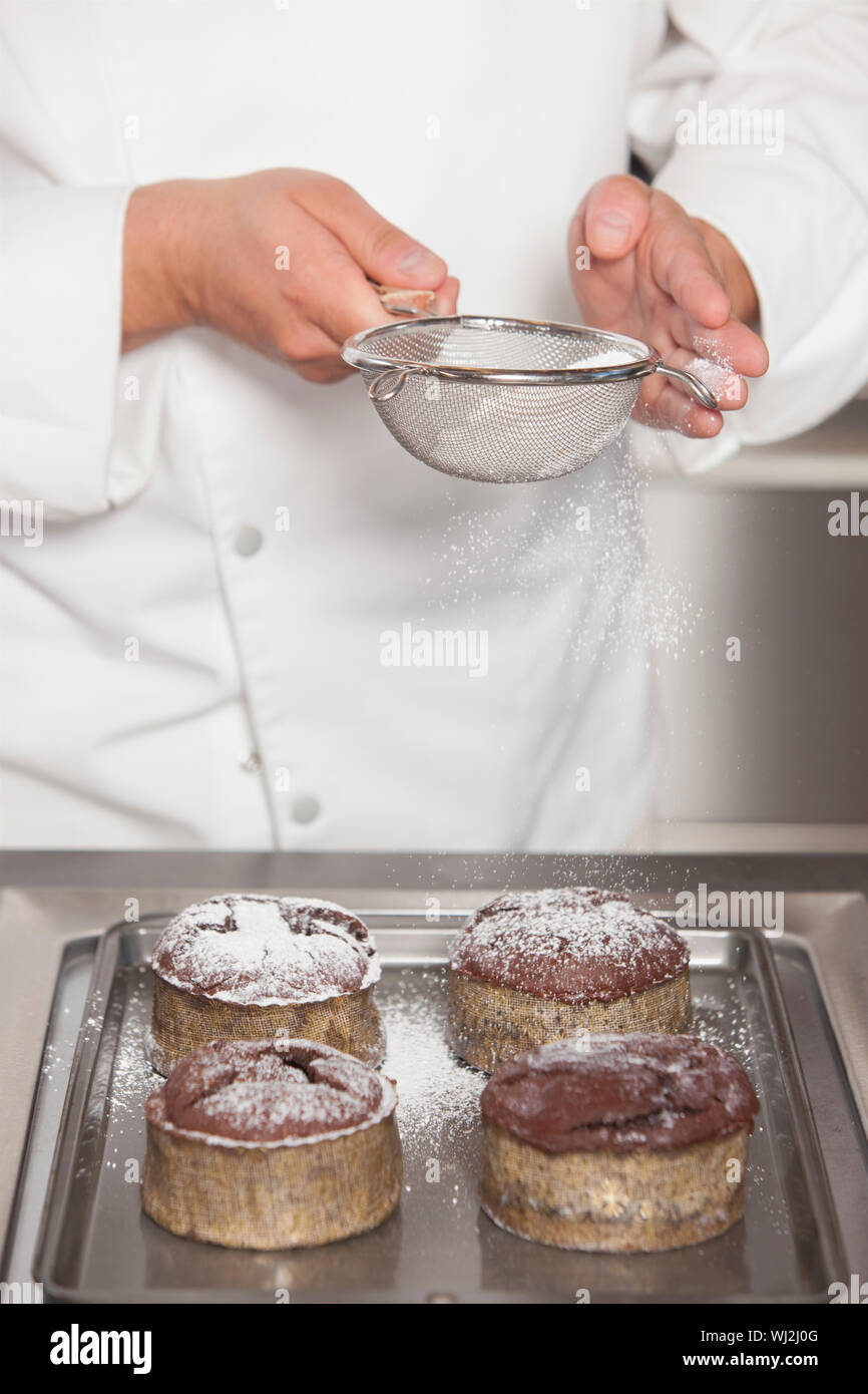Male chef icing cake in hi-res stock photography and images - Alamy
