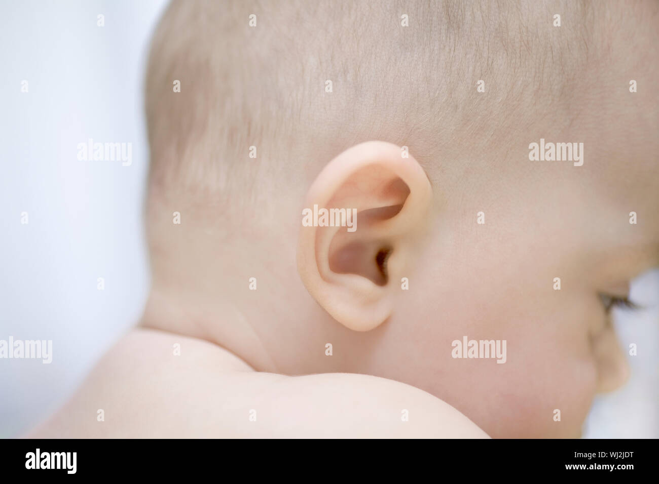 Closeup side view of baby boy Stock Photo - Alamy