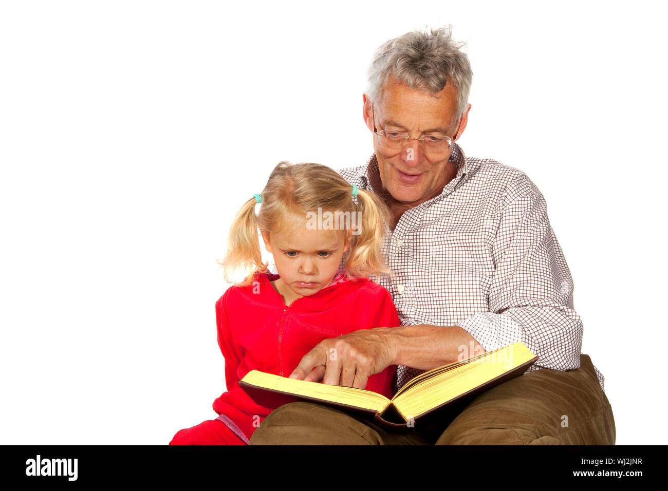 Grandfather is telling a exciting story to his grandchild Stock Photo ...