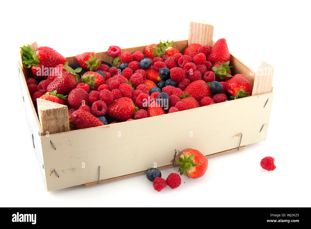 wooden crate with forest fruit Stock Photo - Alamy
