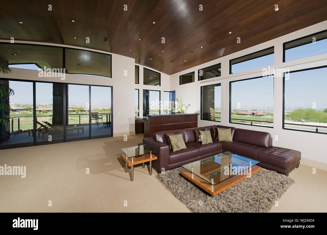 Interior with furniture and large windows with outside views Stock ...