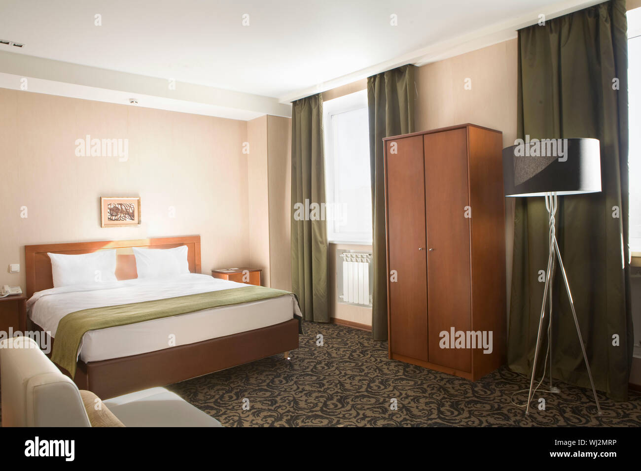 An empty interior of a luxury hotel bedroom with simple furniture Stock ...