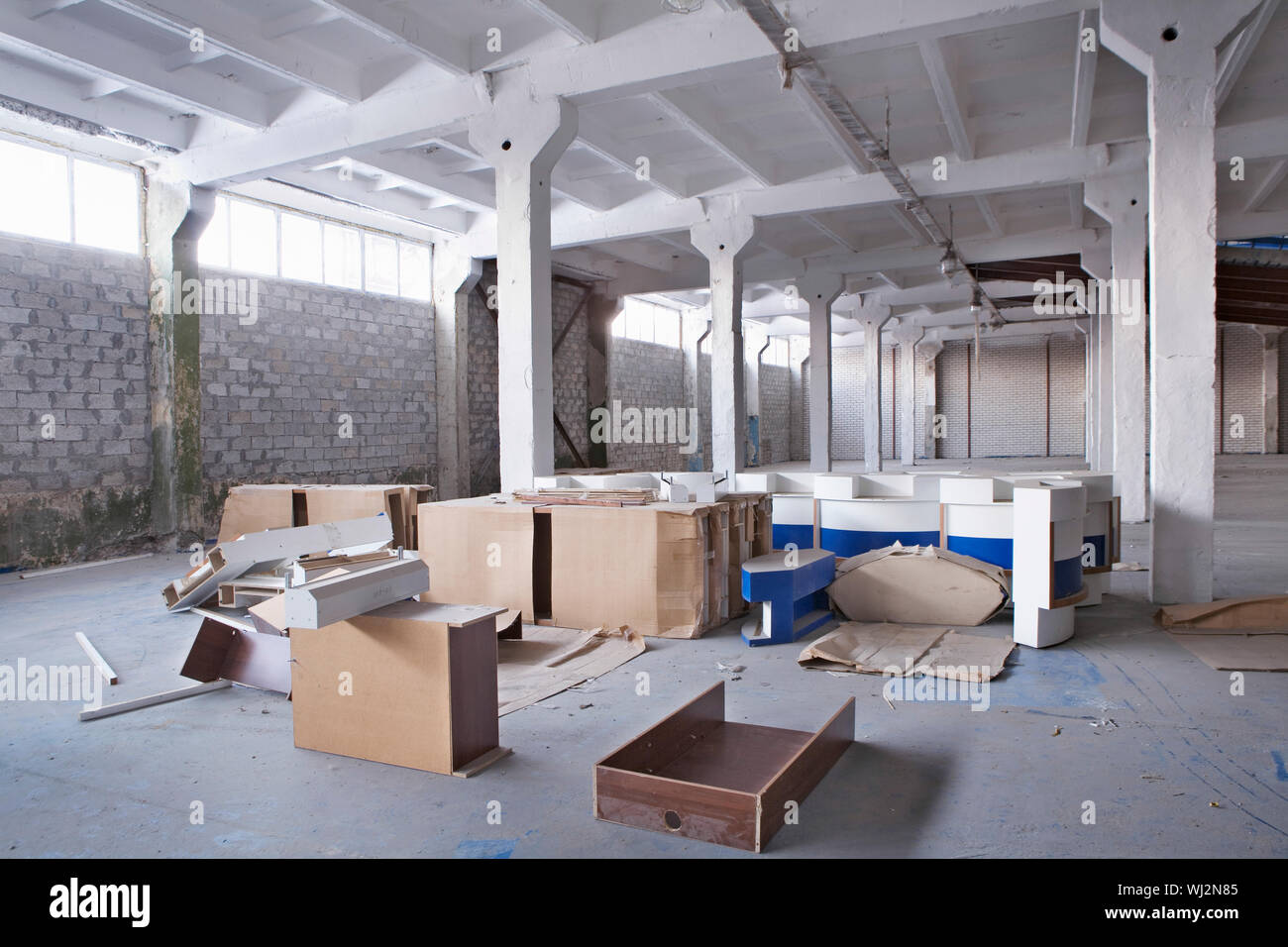 Interior of an abandoned warehouse with broken drawers Stock Photo - Alamy