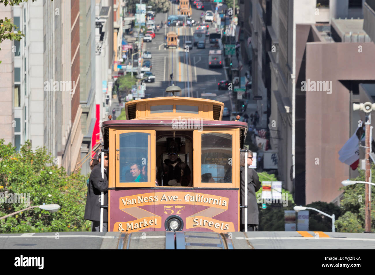 Cable car climbing hill in San Francisco. Front face of a cable car ...
