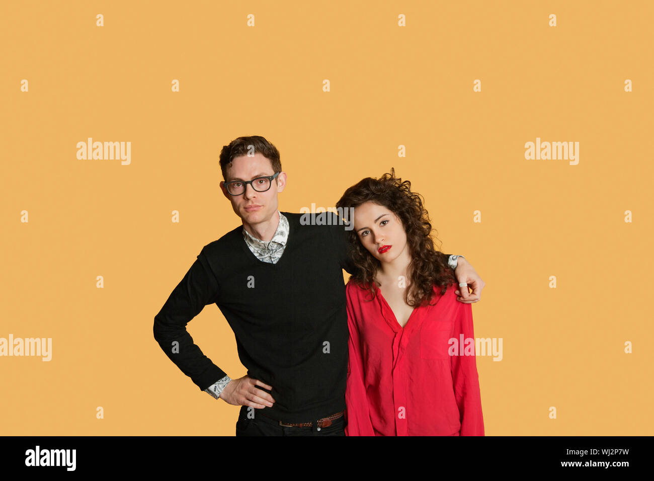 Portrait of friends standing together over colored background Stock ...