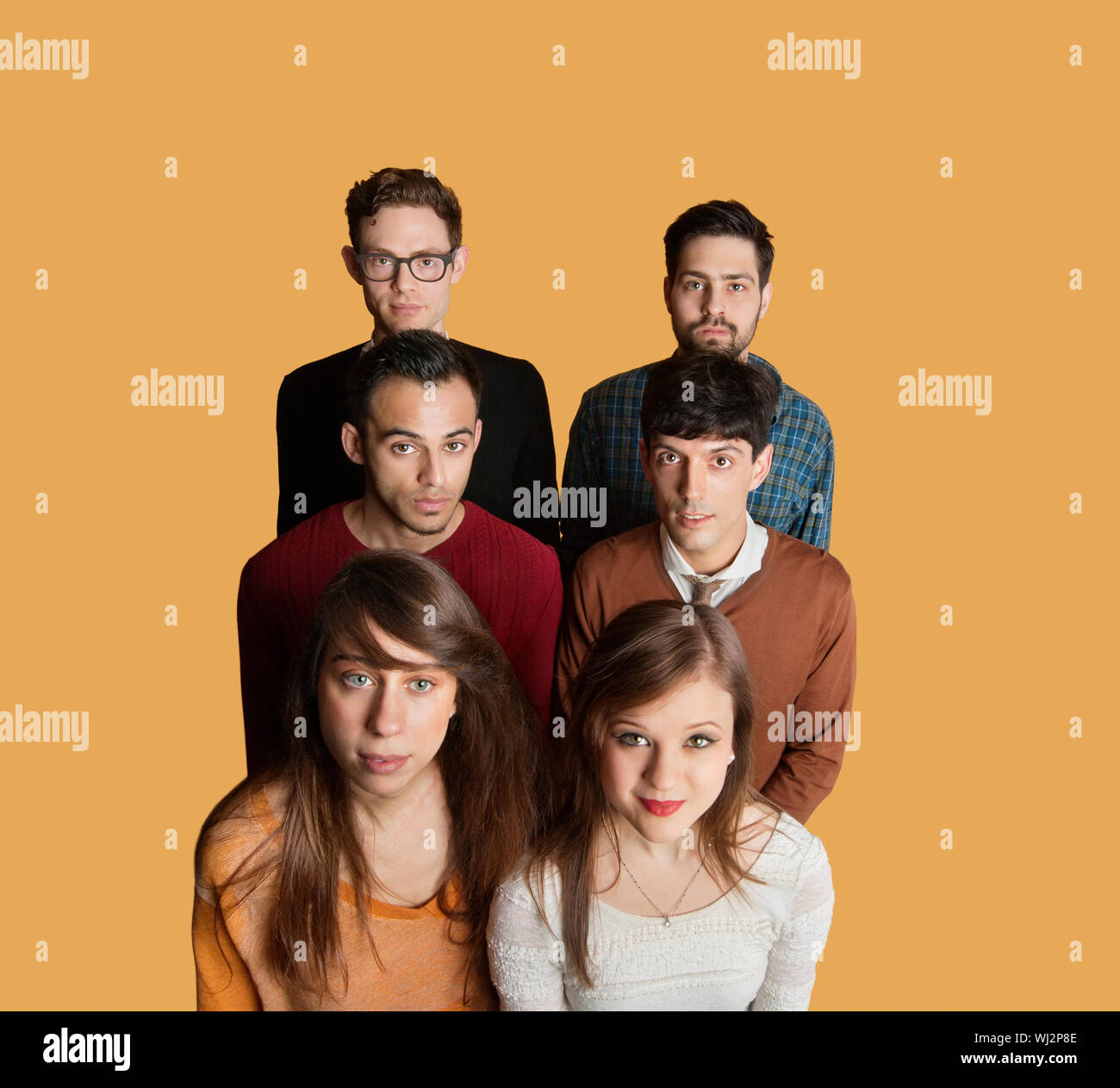 Portrait of multiethnic group of friends over colored background Stock ...