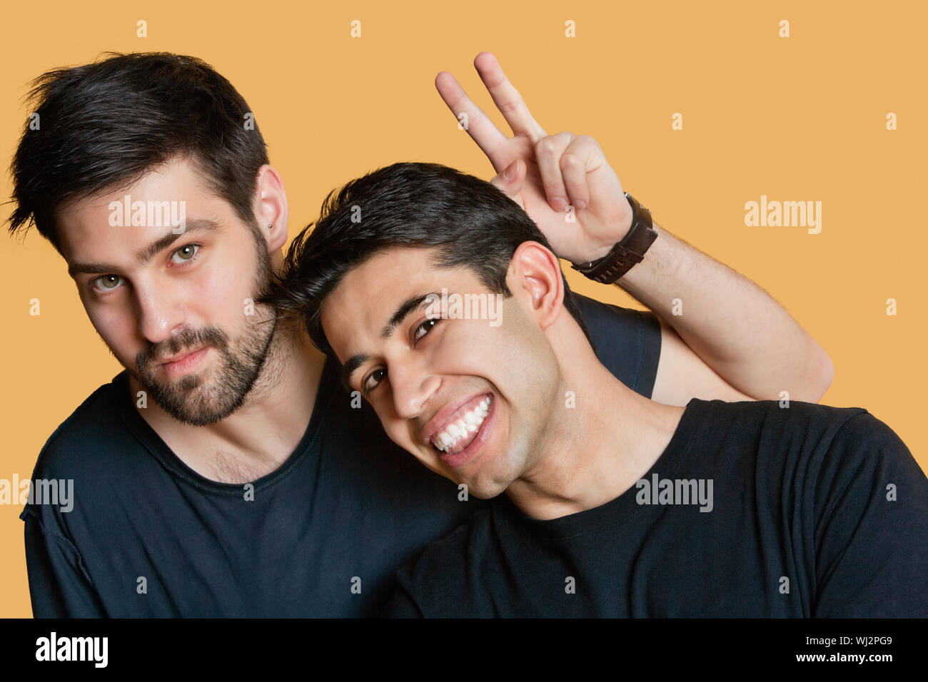 Peace sign over head hi-res stock photography and images - Alamy