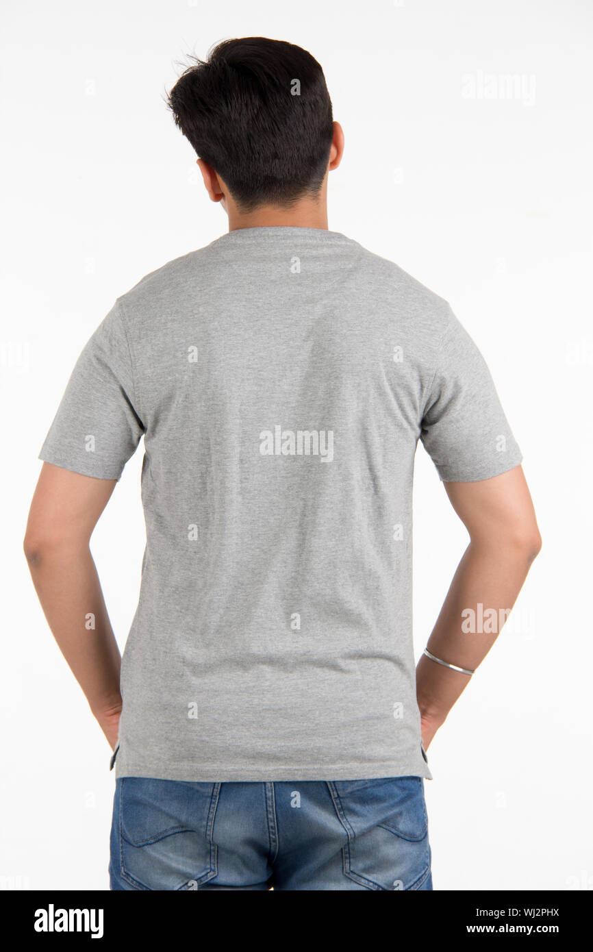 Rear view of an Indian young man standing Stock Photo - Alamy
