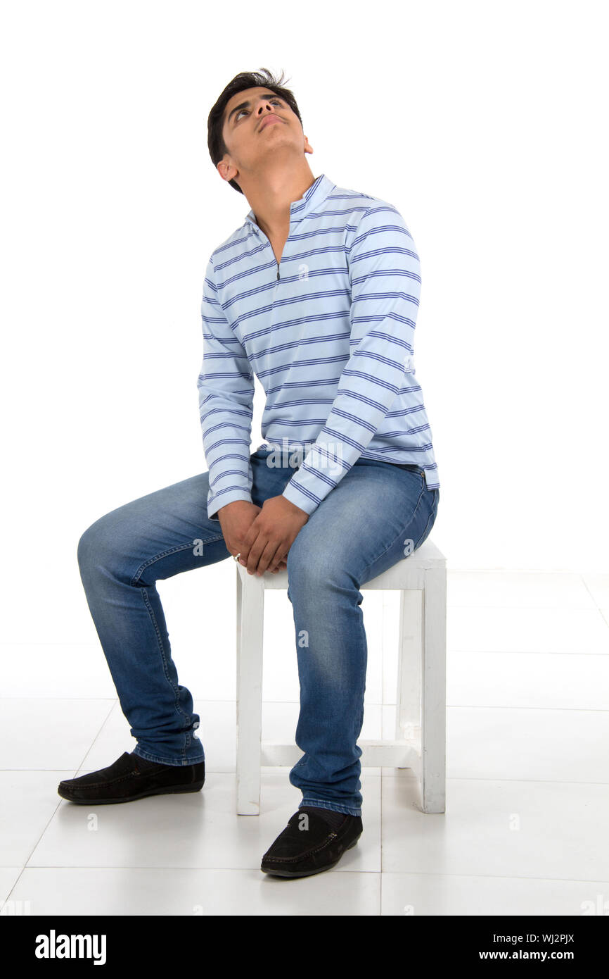 Man sitting on stool hi-res stock photography and images - Alamy