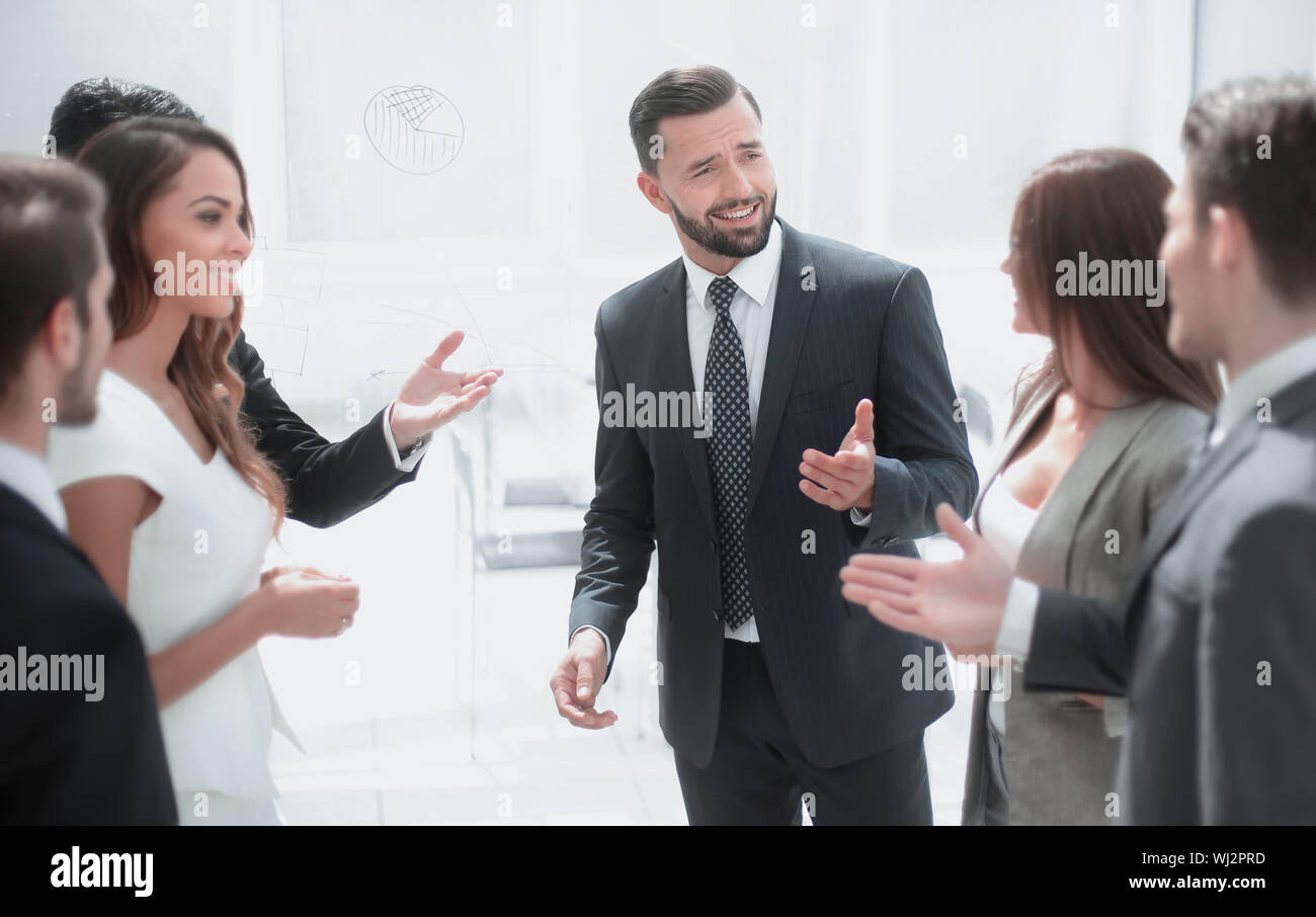 close up.the project Manager talks to the business team Stock Photo - Alamy