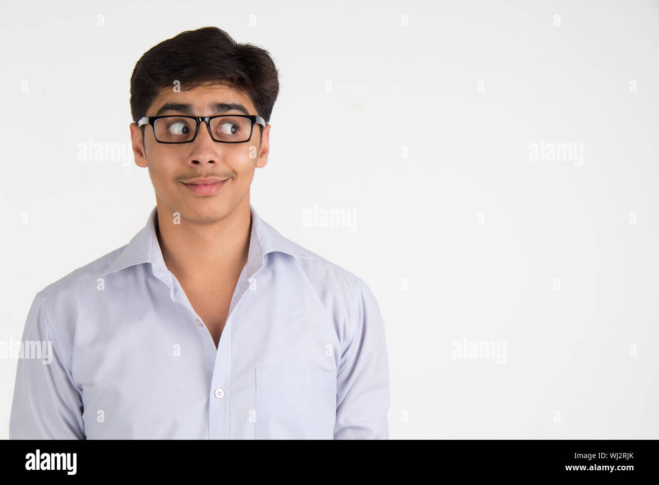 Nosy young man trying to listen carefully someone conversation isolated ...