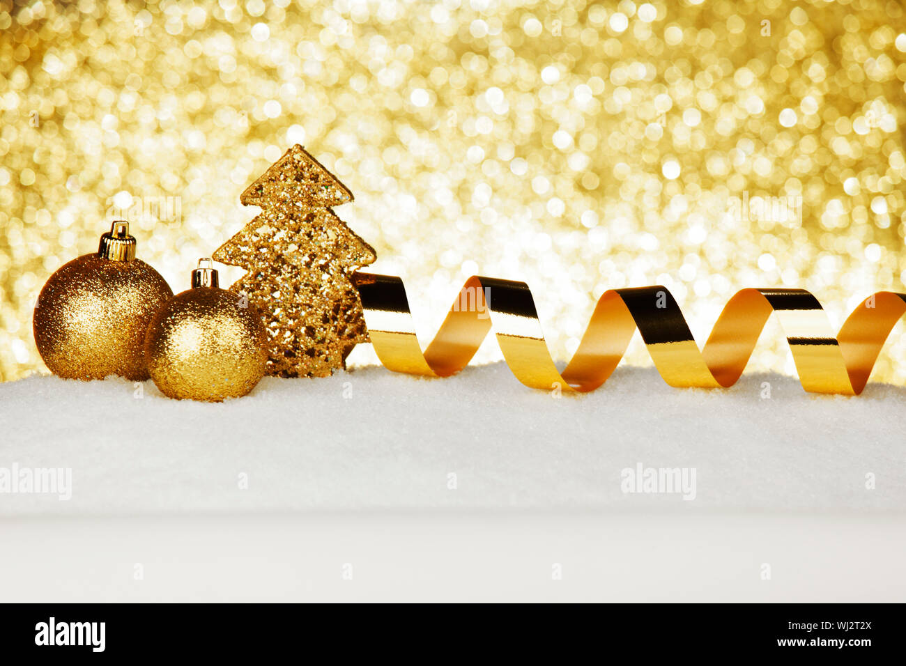 Christmas decorative balls and ribbons on snow Stock Photo - Alamy