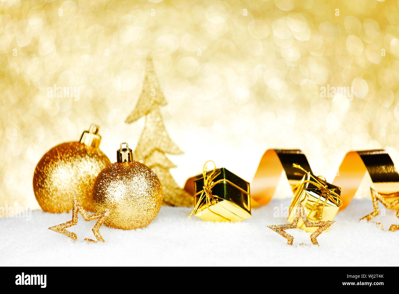 Christmas decorative balls and ribbons on snow Stock Photo - Alamy