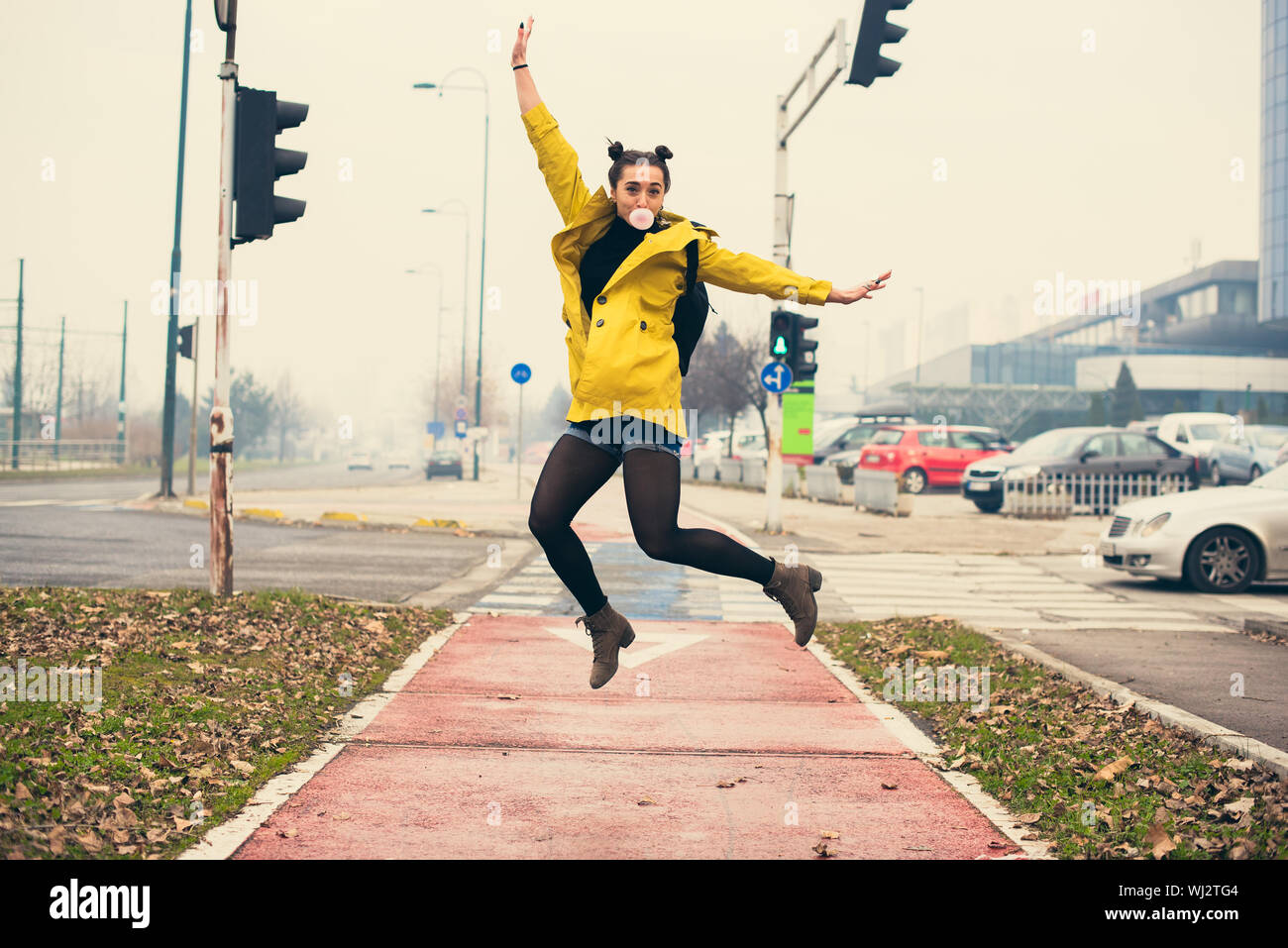 Blowing bubble gum in street hi-res stock photography and images - Alamy