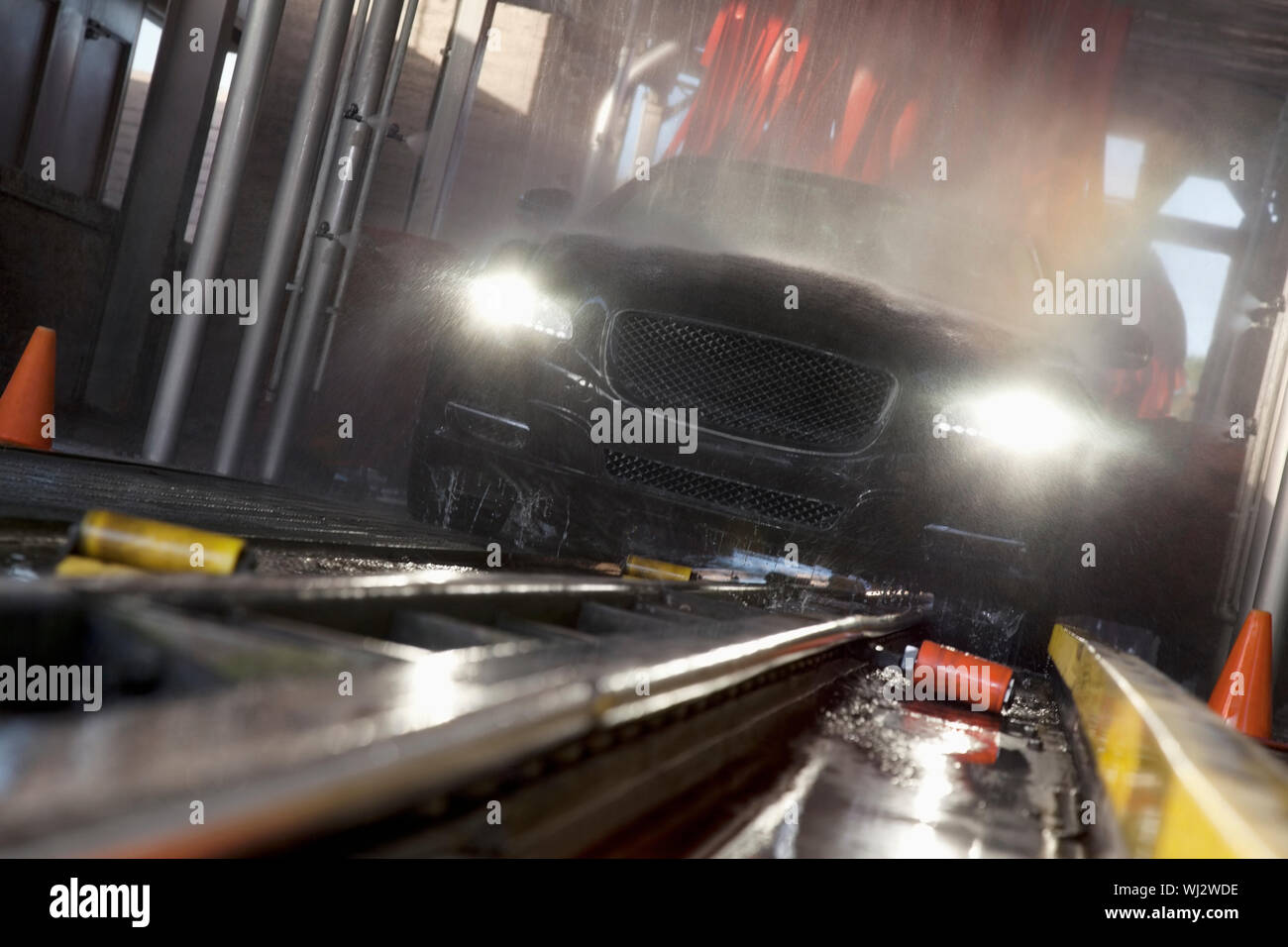 Front view of car passing through car wash process Stock Photo - Alamy