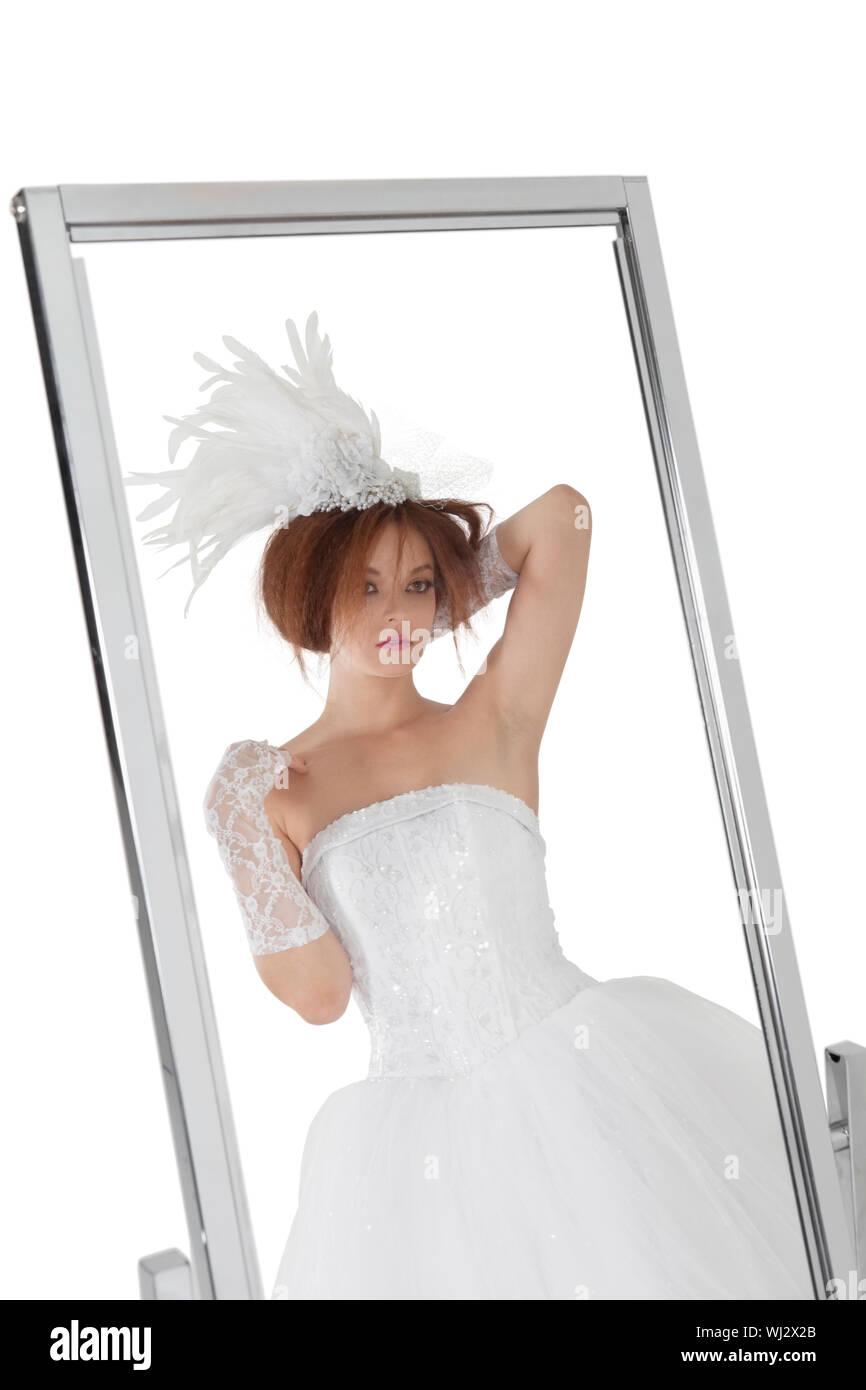 Reflection of young bride in mirror over white background Stock Photo ...