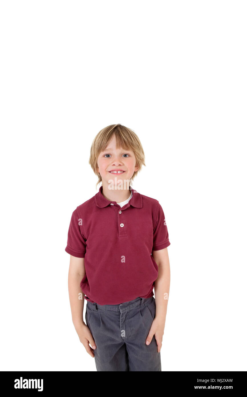 Portrait of happy elementary boy in school uniform over white ...