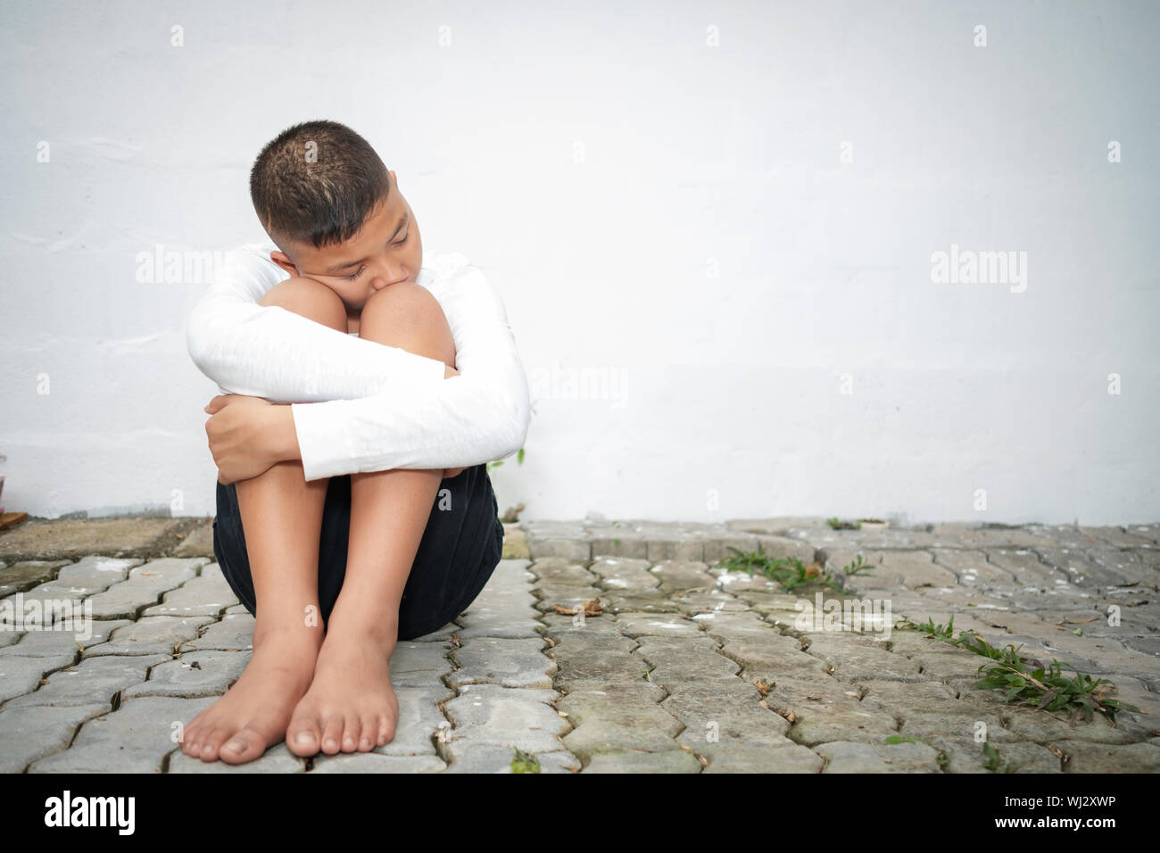 Boy On Knees High Resolution Stock Photography and Images - Alamy