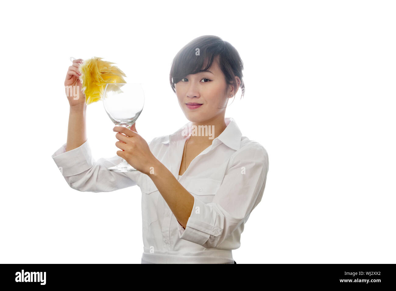 Portrait of Asian woman dusting glass with backlit over white ...