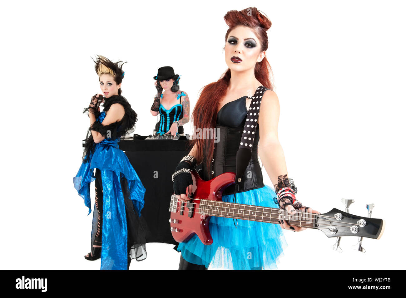 Beautiful all female rock band over white background Stock Photo - Alamy