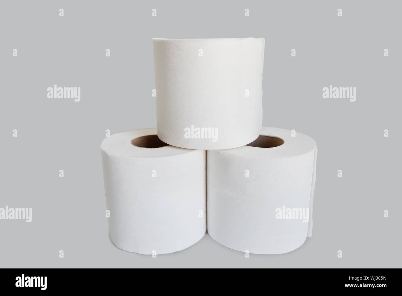 Close-up view of toilet paper stack on white background Stock Photo - Alamy