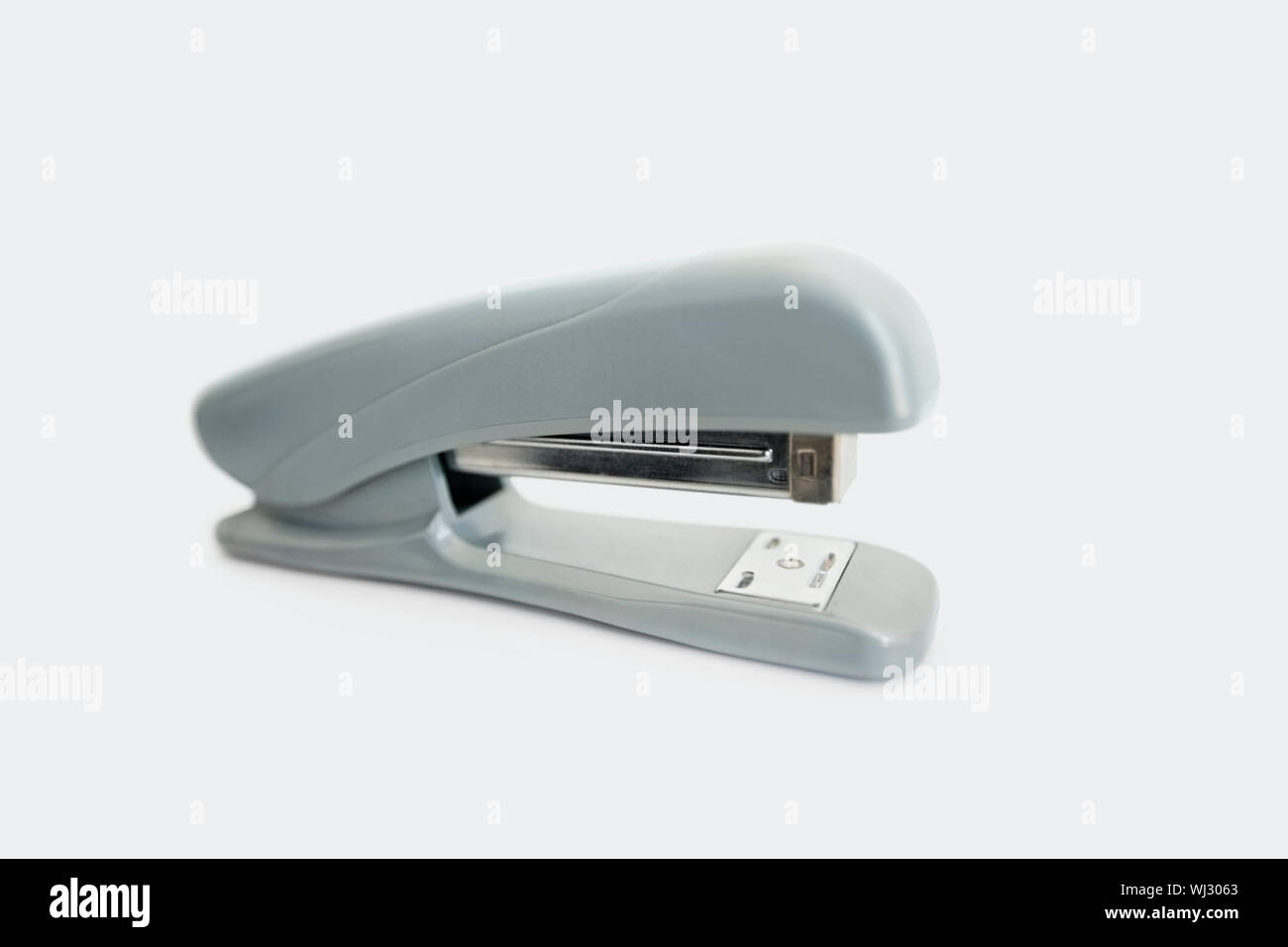 Close-up view of office stapler over white background Stock Photo - Alamy