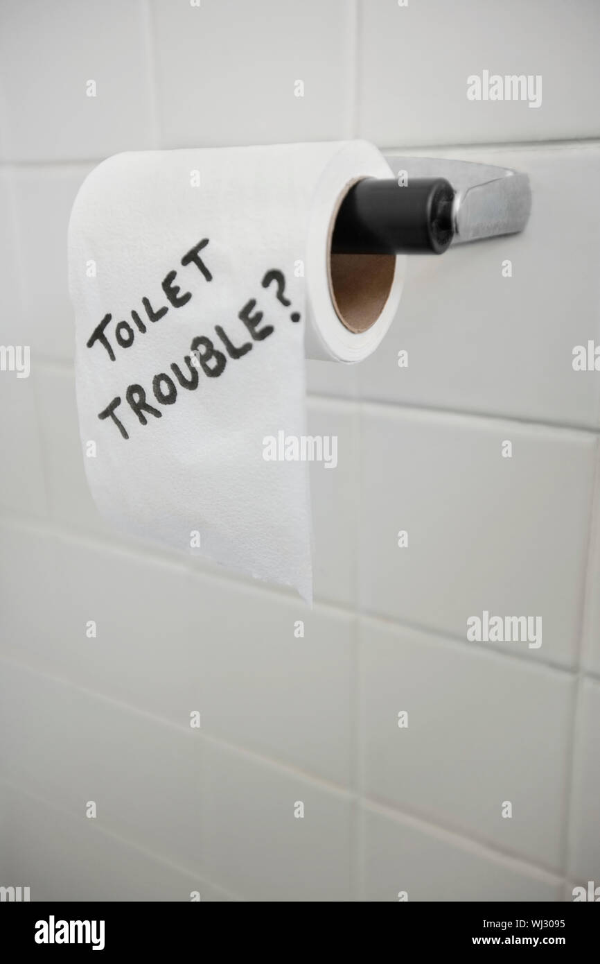 Close-up of text written on tissue paper in bathroom depicting toilet ...