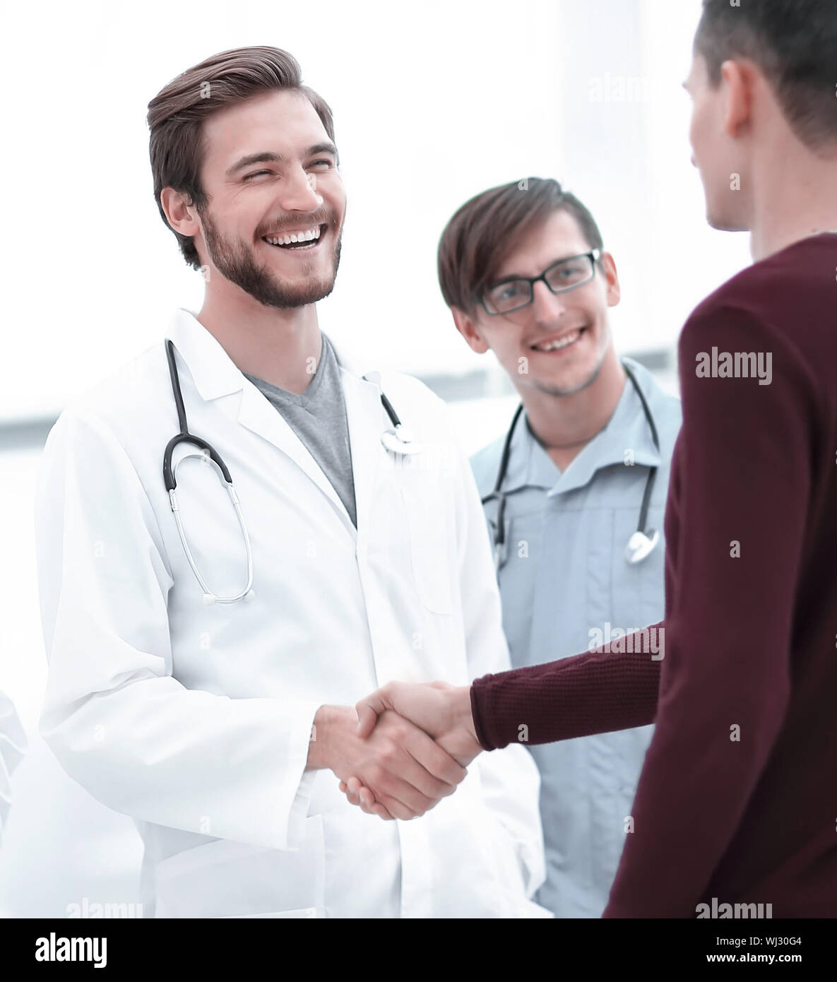 Doctor business man shake hands hi-res stock photography and images - Alamy