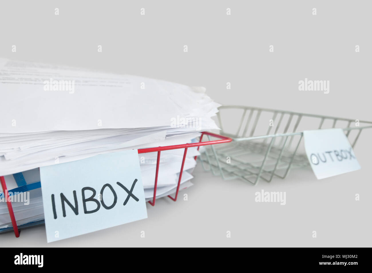 Inbox and outbox trays in an office over white background Stock Photo ...