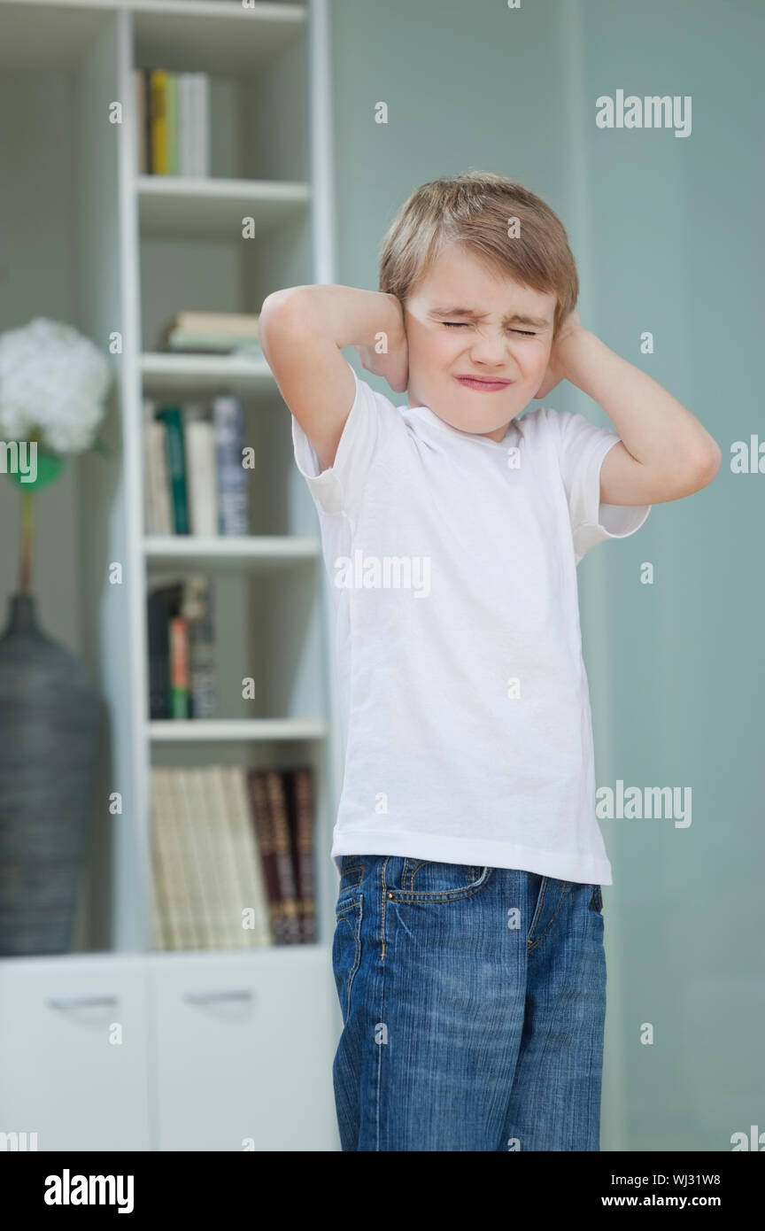 Boy with hands over his ears hi-res stock photography and images - Alamy
