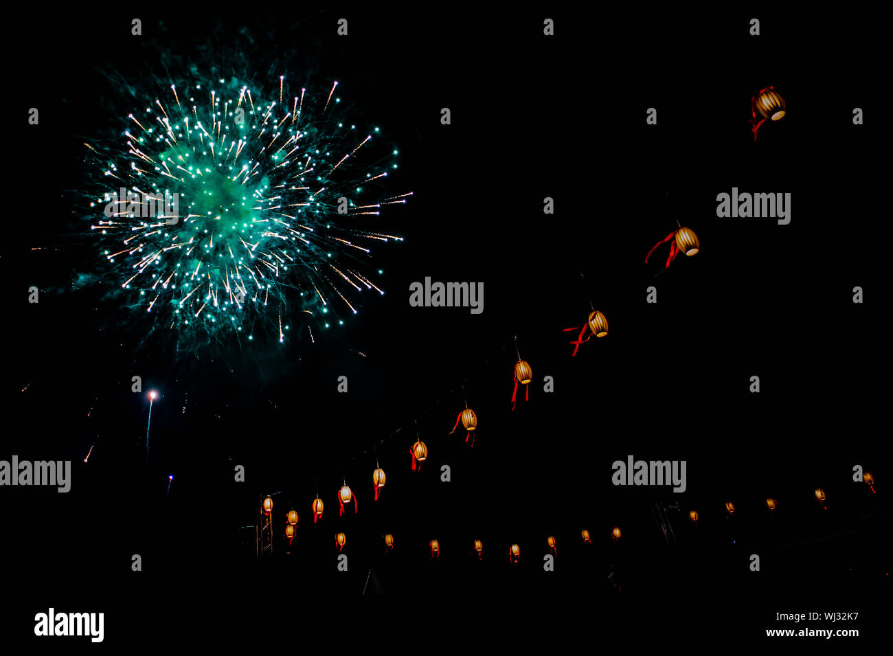 Man lighting a firework hi-res stock photography and images - Alamy