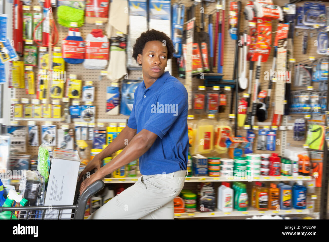 Side view of African American in hardware store Stock Photo - Alamy