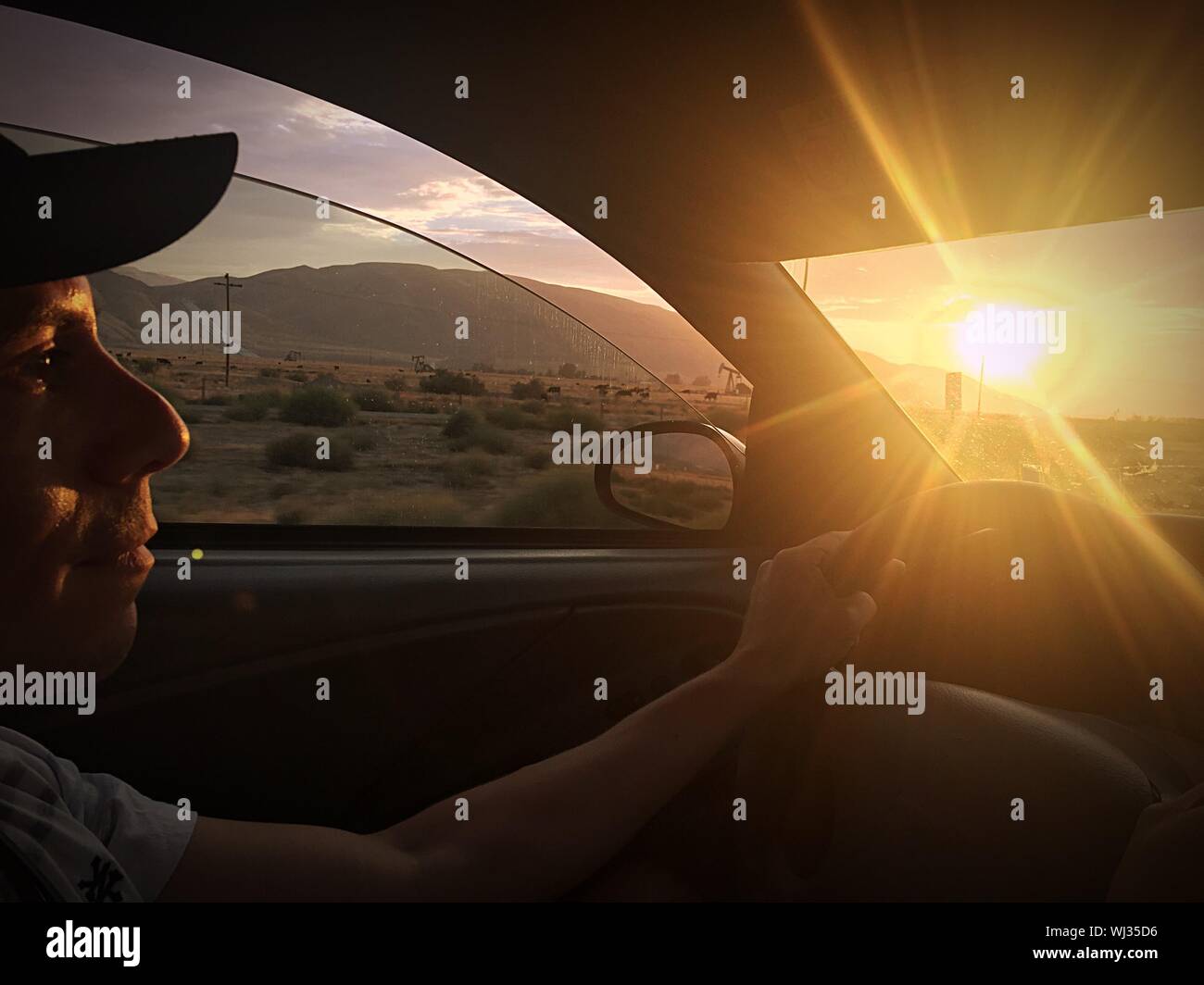 Driving into sunset hi-res stock photography and images - Alamy