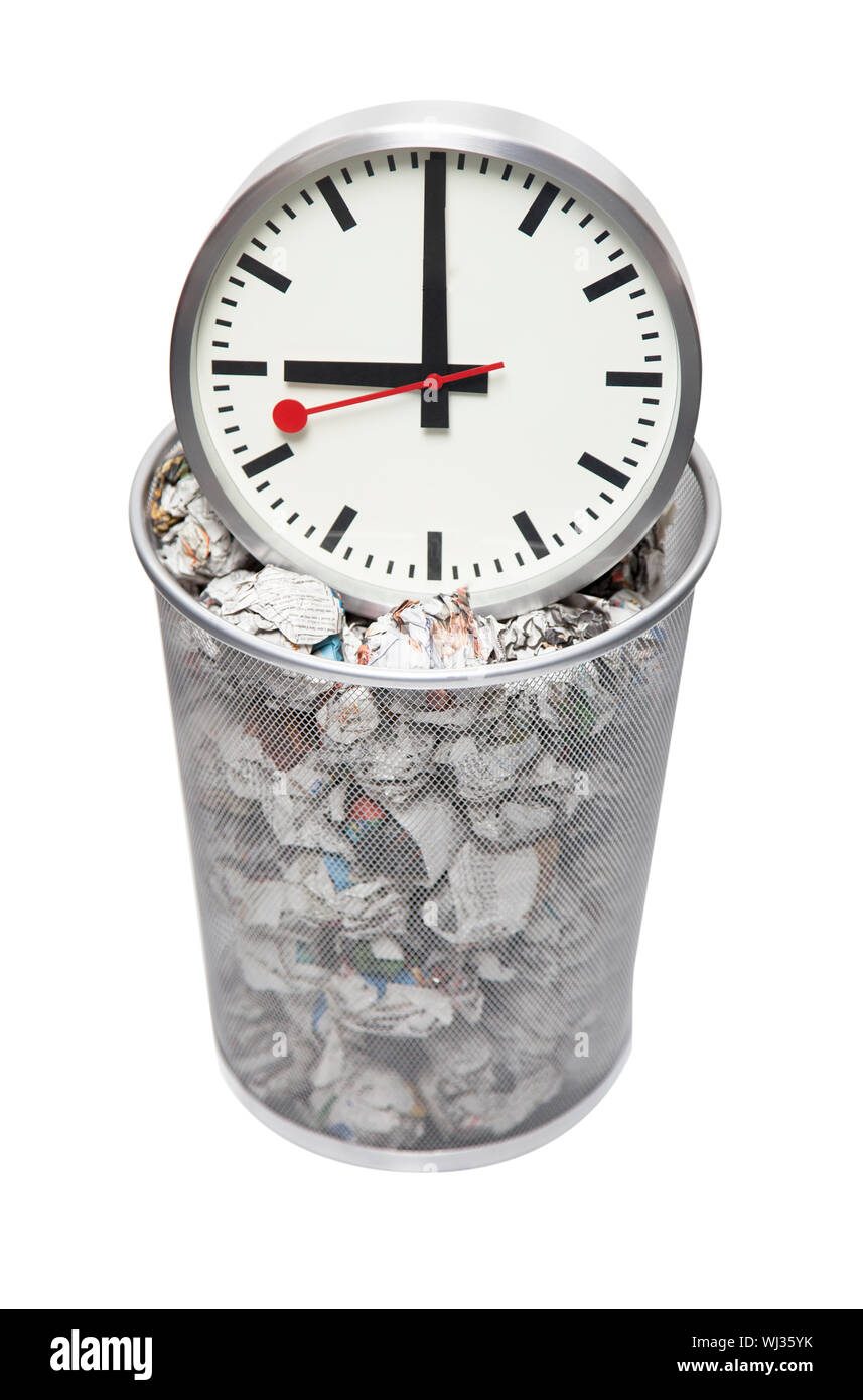 Clock in wastebasket full of crumpled paper over white background Stock ...