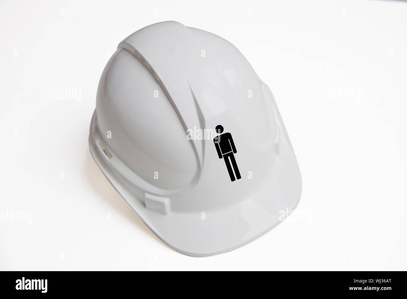 Men's sign on hard hat against white background Stock Photo - Alamy