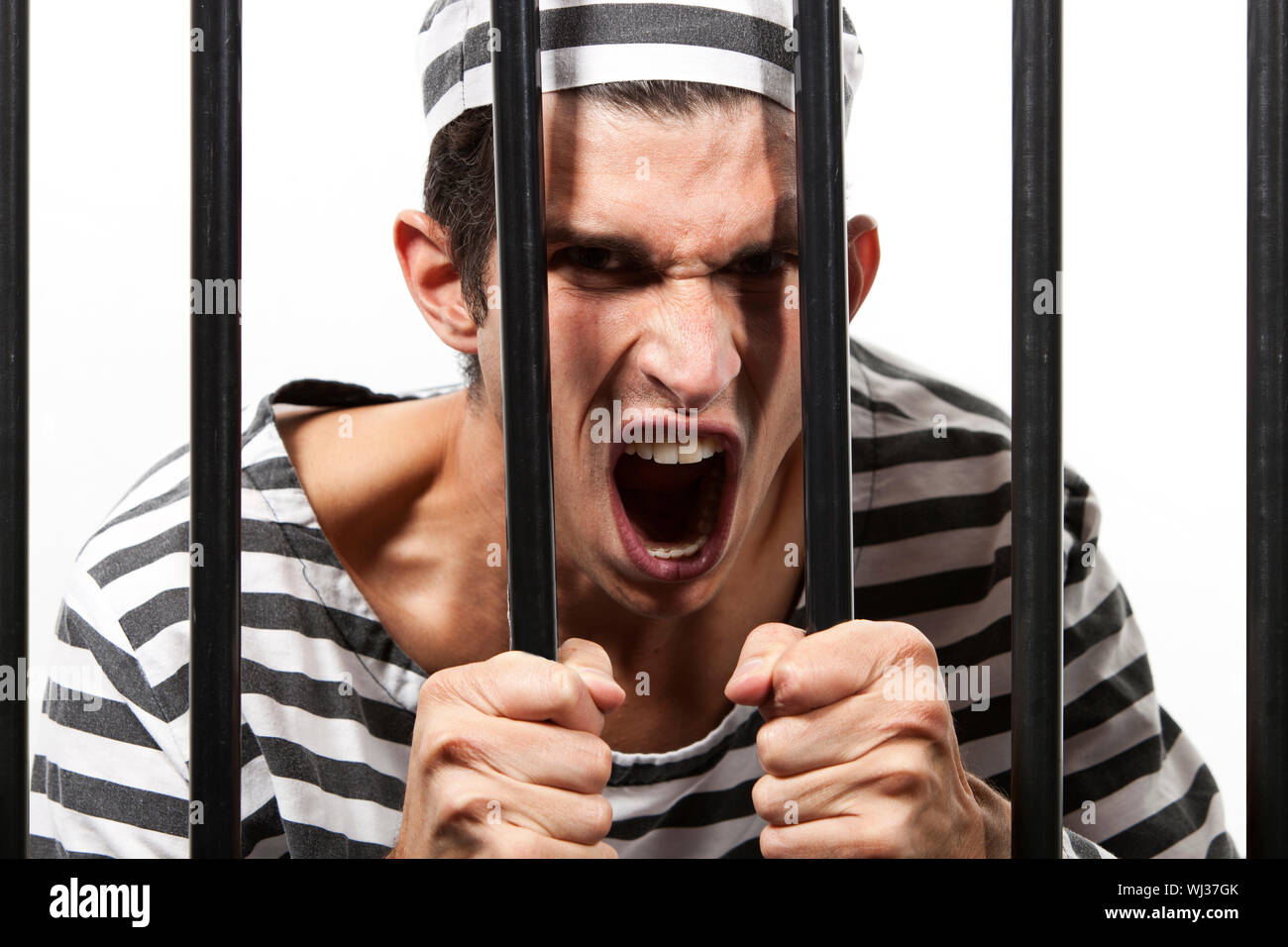 Convict yells through prison bars Stock Photo - Alamy