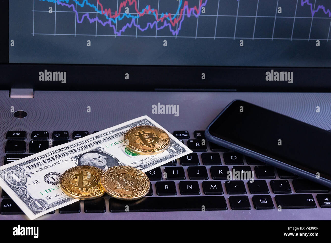 Coin Bitcoin close-up, and schedule the exchange in background Stock ...