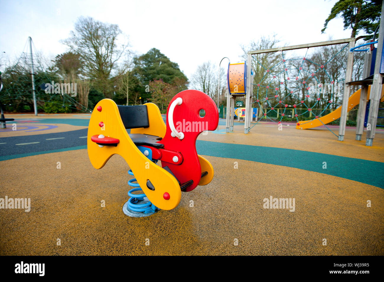 Playground rocking horse Stock Photo - Alamy