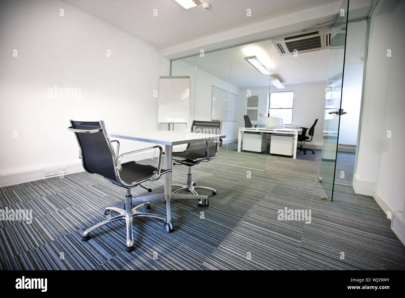 Wide view of office interior Stock Photo - Alamy