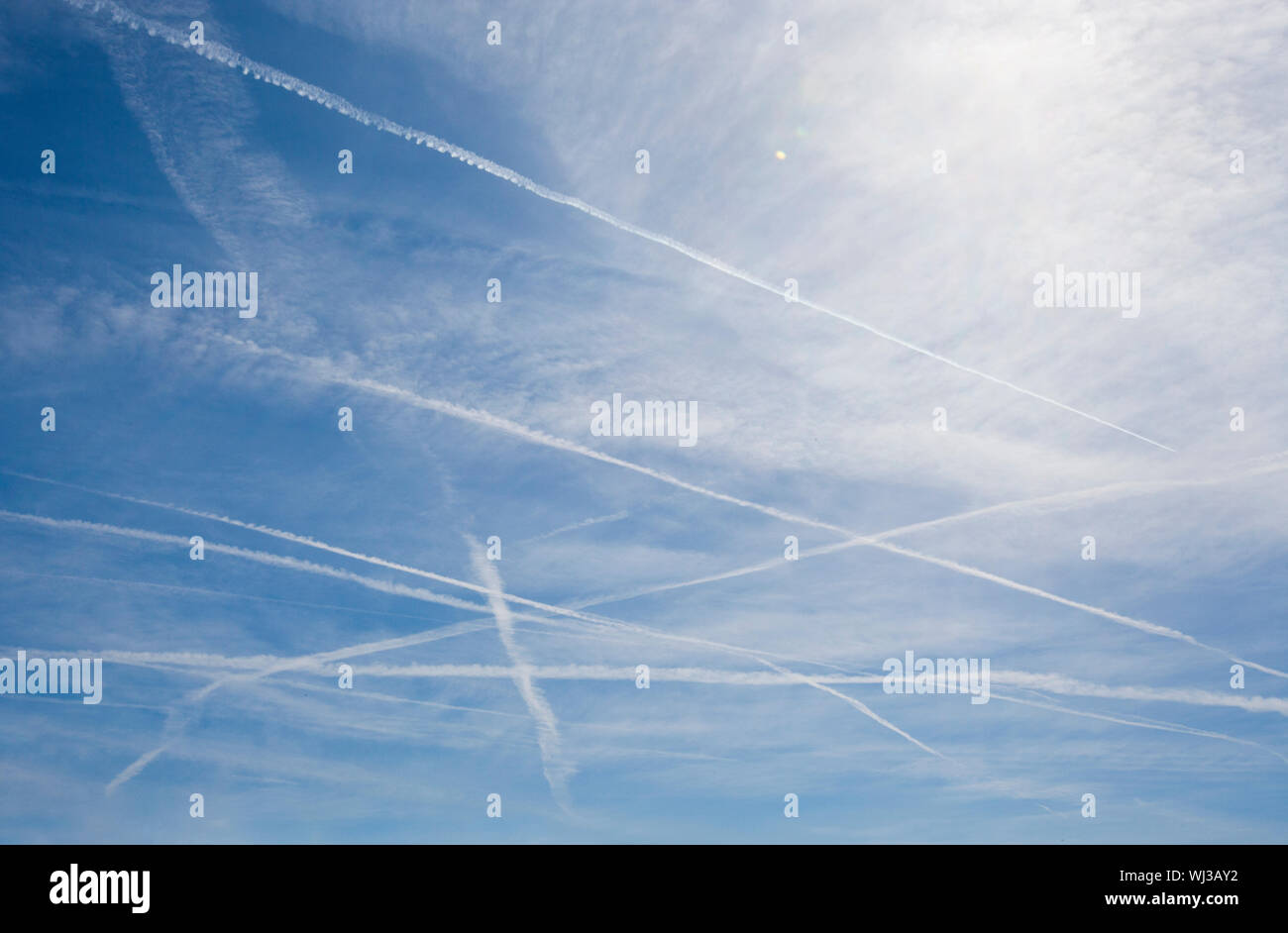 Multiple Jet Streams on Blue Sky Stock Photo - Alamy