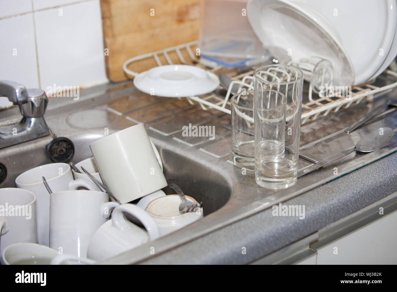 Dirty washing up pile in sink hi-res stock photography and images - Alamy