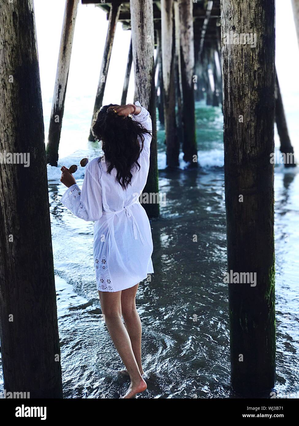 Woman pier wading water hi-res stock photography and images - Alamy