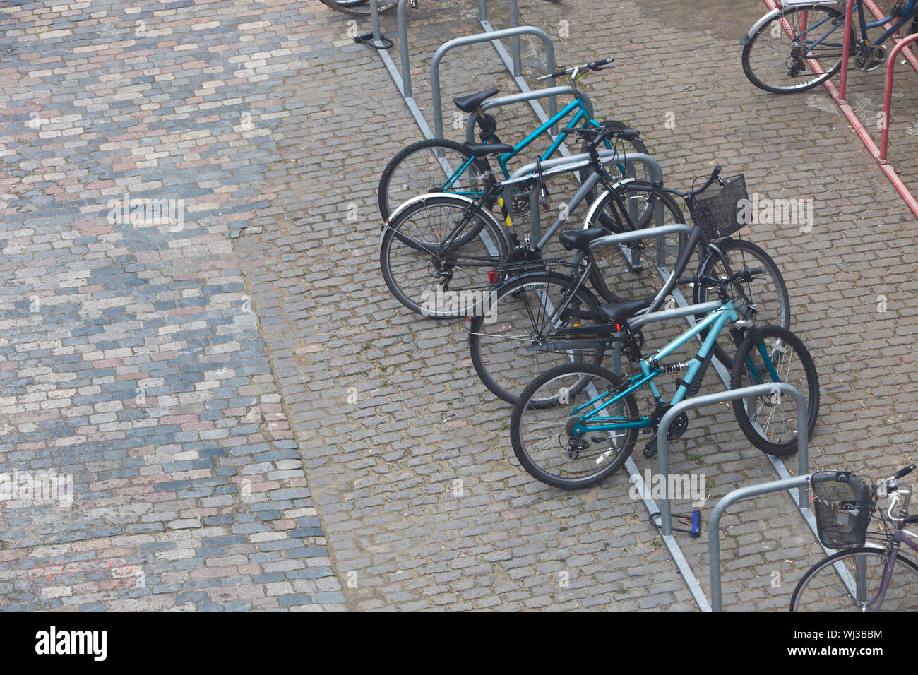 Bicycles chained up to railings Stock Photo - Alamy
