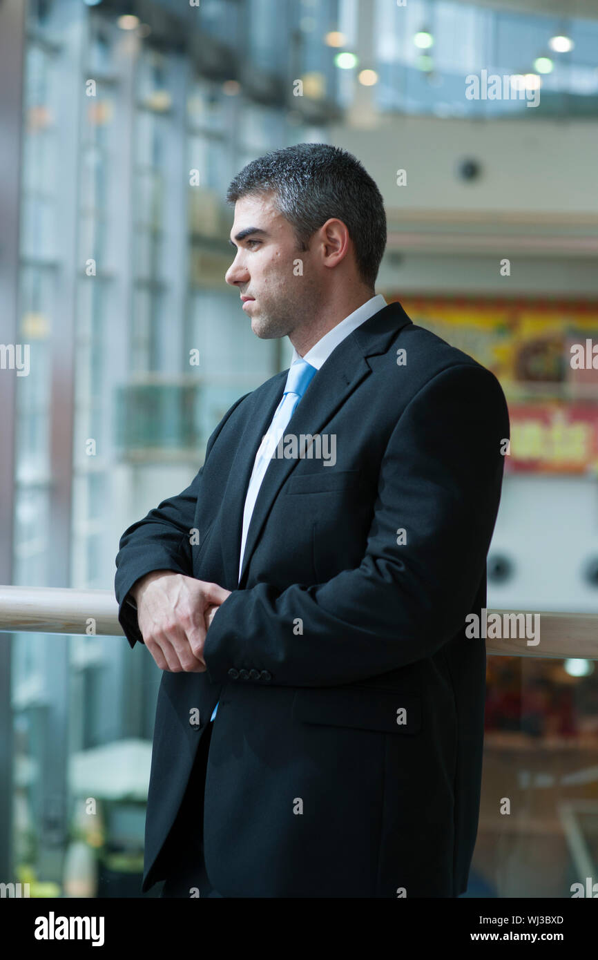 Businessman with serious expression looking off camera Stock Photo - Alamy