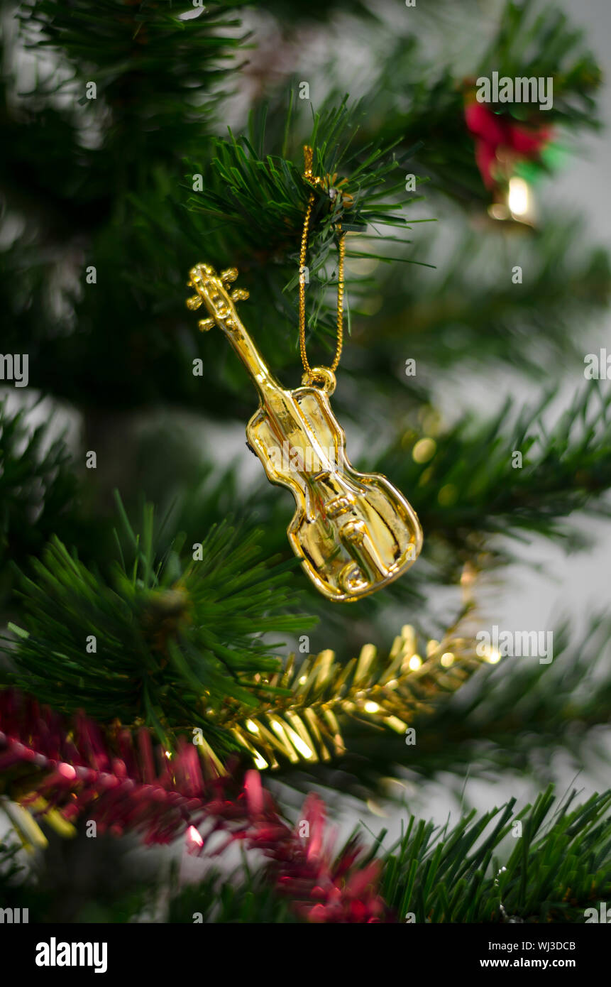 close up violin on christmas tree Stock Photo - Alamy