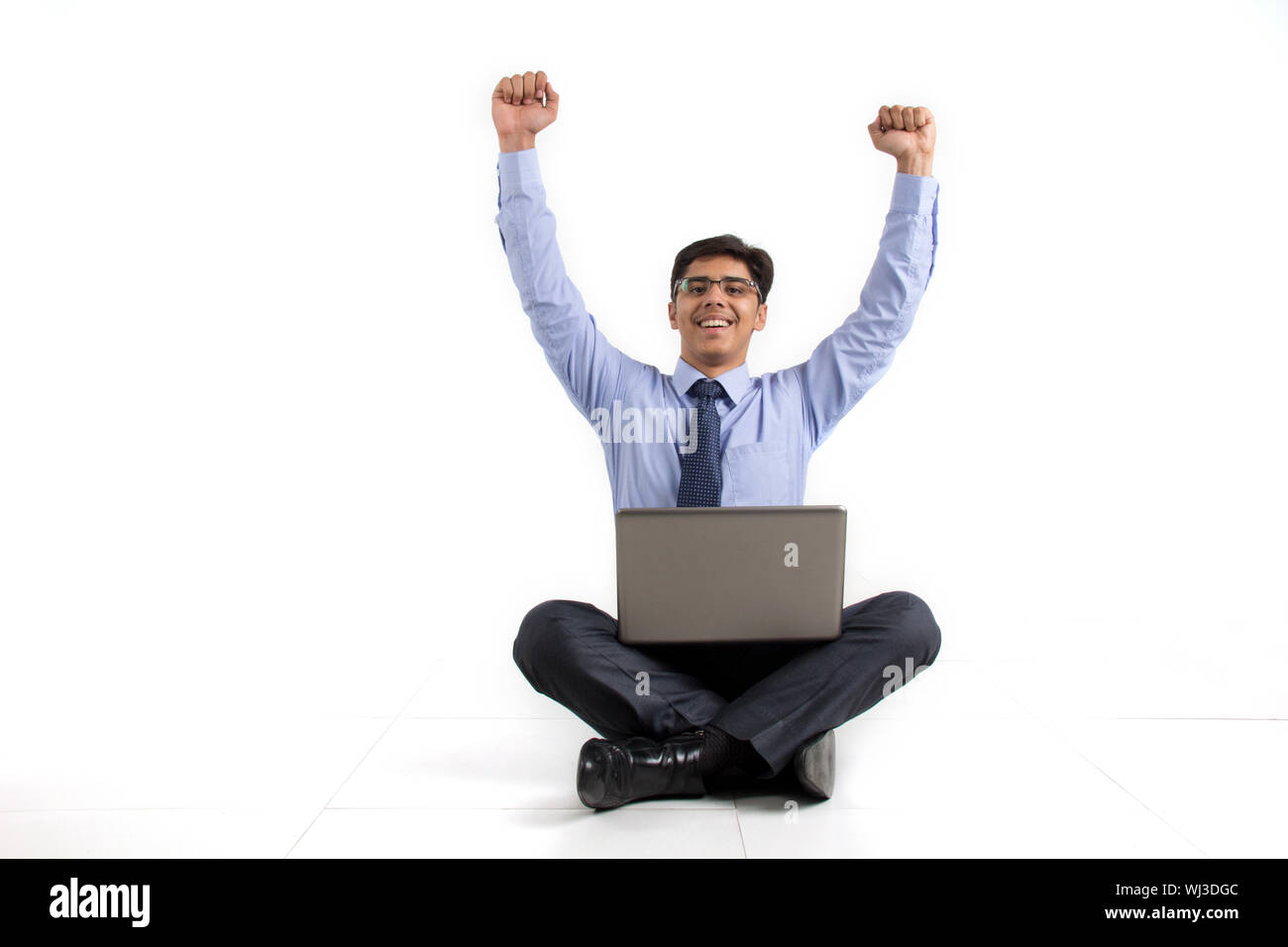 Man celebrating success on laptop hi-res stock photography and images ...
